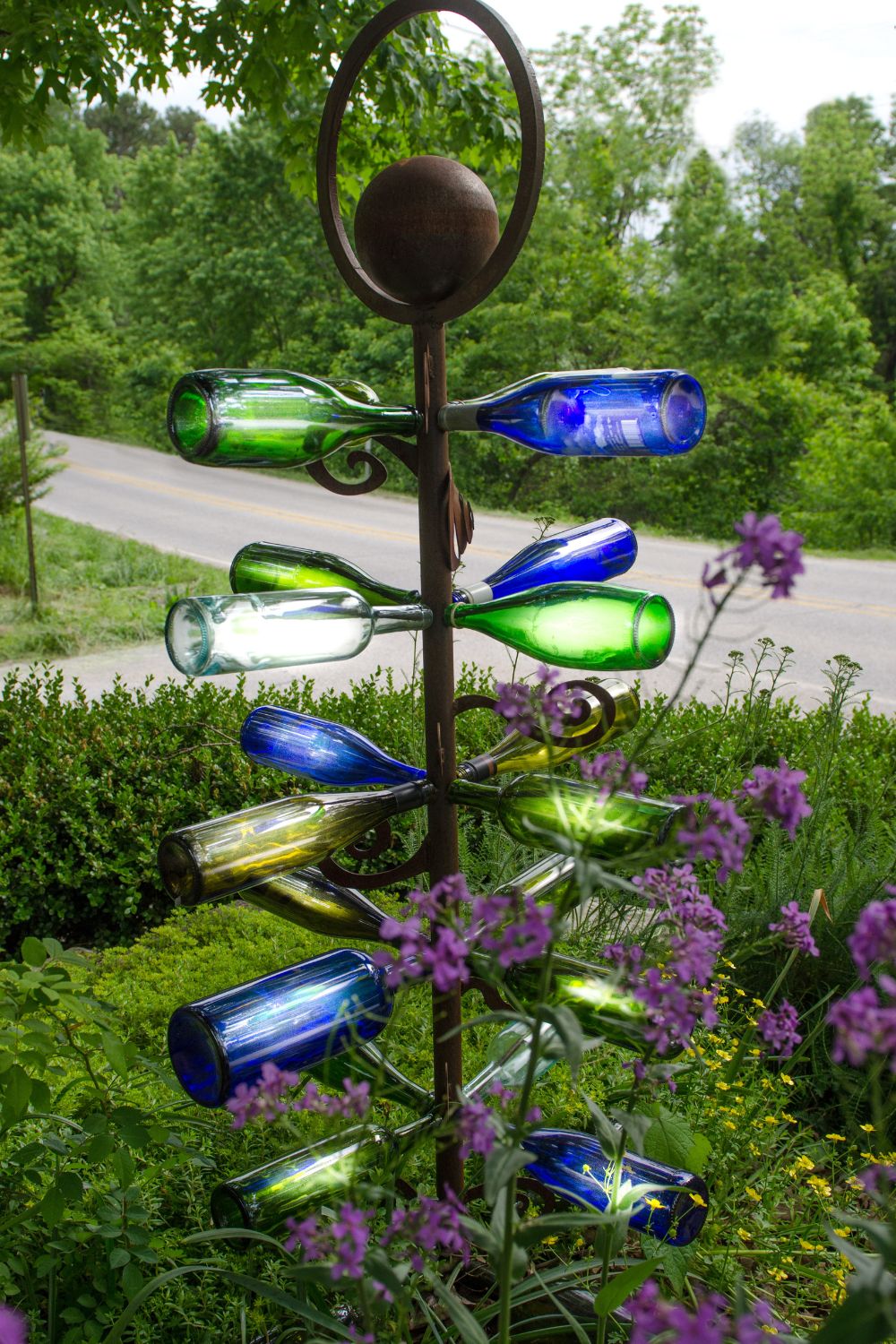 Is There a Hidden Meaning Behind Hanging Glass Bottles from Trees ...